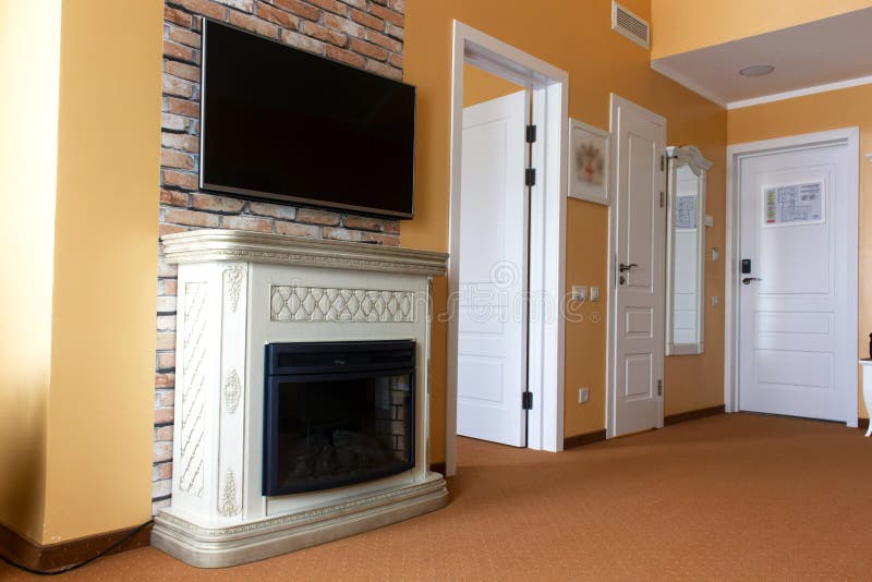 Beautiful Hotel Room with Fireplace and Tv Set. Stock Photo - Image of ...