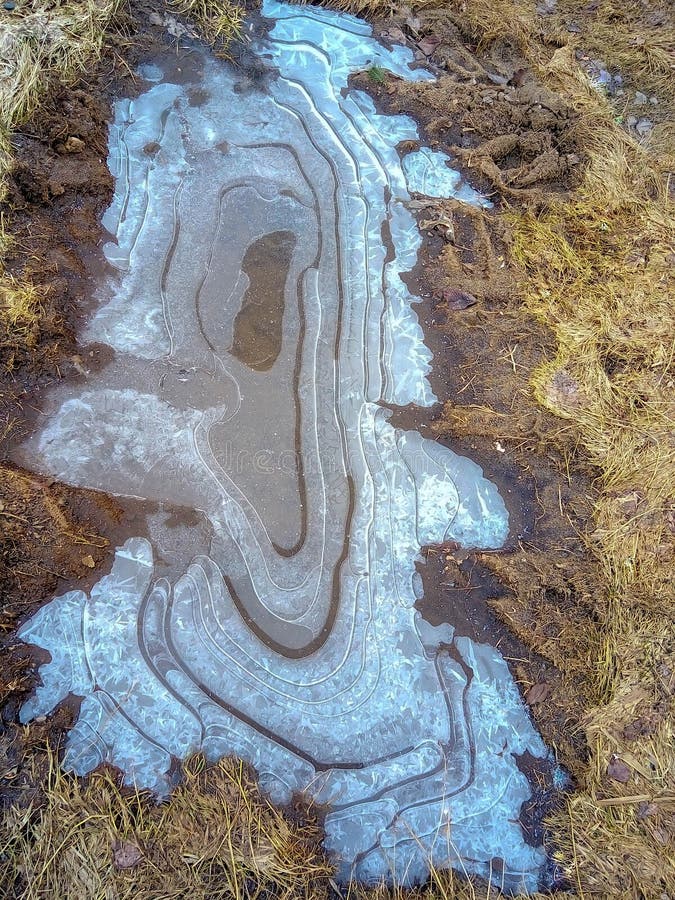 Beautiful Ice Pattern on a Small Puddle in the Early March Morning ...