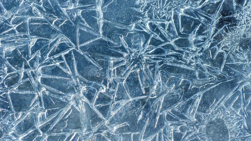 Beautiful Ice Texture with Cracks of a Frozen Puddle on the Asphalt for ...