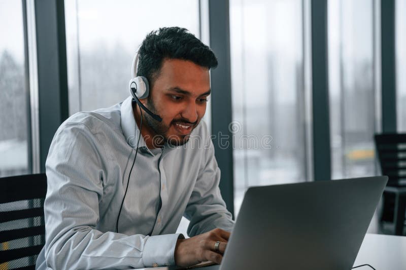 Beautiful Indian Man is Working in the Office by Laptop Stock Image ...