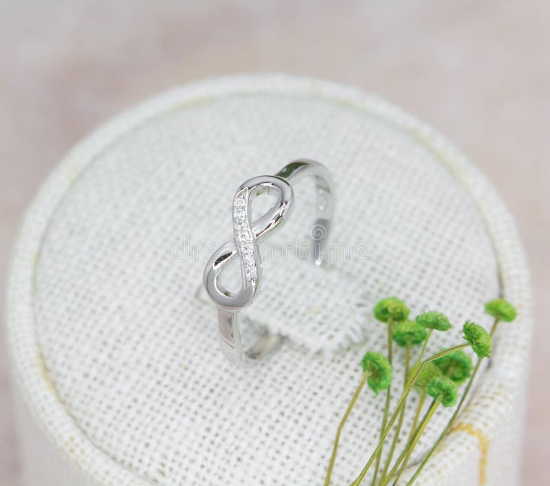 Beautiful Infinity Shape Silver Ring Decorated with Diamonds Stock ...