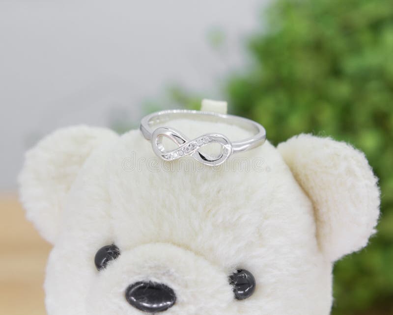 Beautiful Infinity Shape Silver Ring Decorated with Diamonds Stock ...