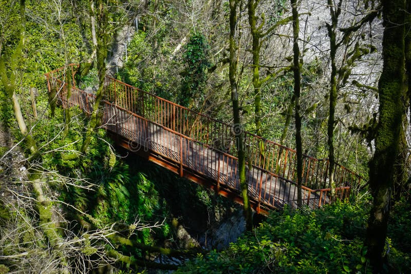 Beautiful Iron Bridge Over the River and Waterfall Stock Photo - Image ...