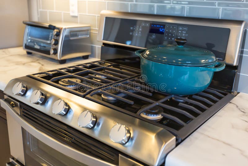 Beautiful Kitchen Stove with Cooking Pot and Toaster Over Stock Photo ...