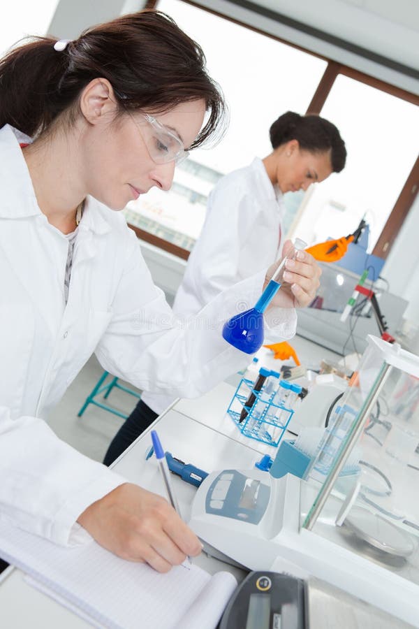 Beautiful Lab Worker Holding Up Test Tube Stock Image - Image of ...
