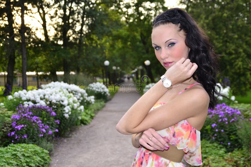 Beautiful lady in a park stock photo. Image of brunette - 20927334