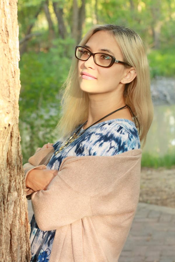 Beautiful lady in the park stock image. Image of shawl - 128542489