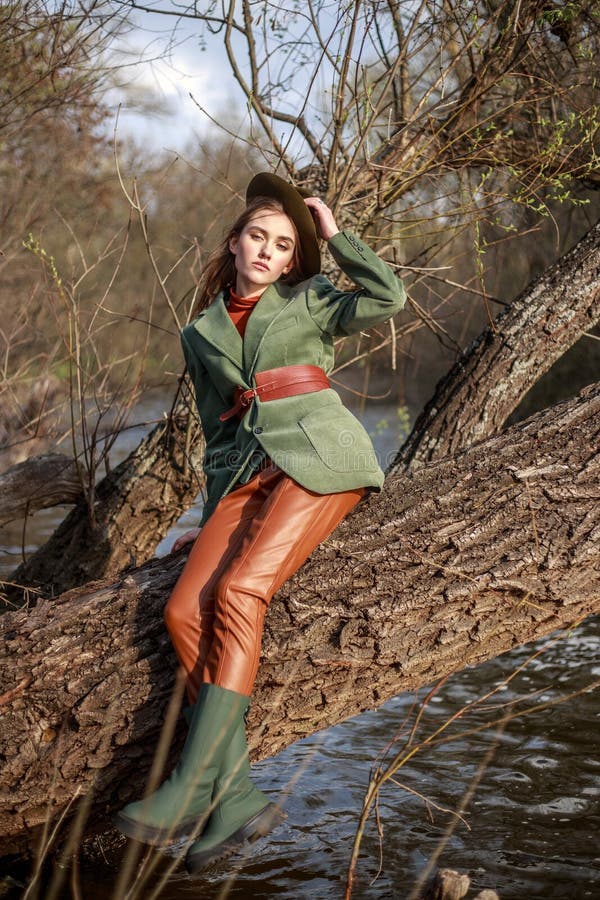 Beautiful Lady in Rustic Style Clothes on Tree by the River Stock Image ...
