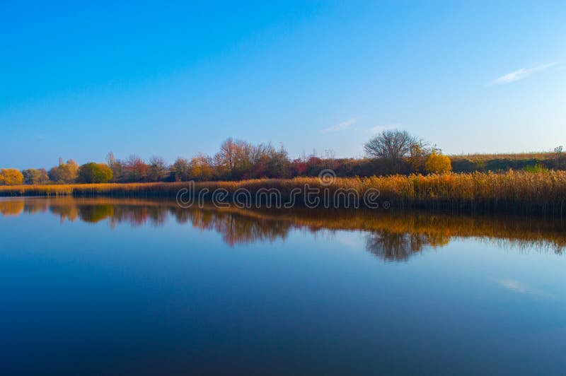 Beautiful Lake with Reflection of Blue Sky and Autumn Trees Stock Photo ...