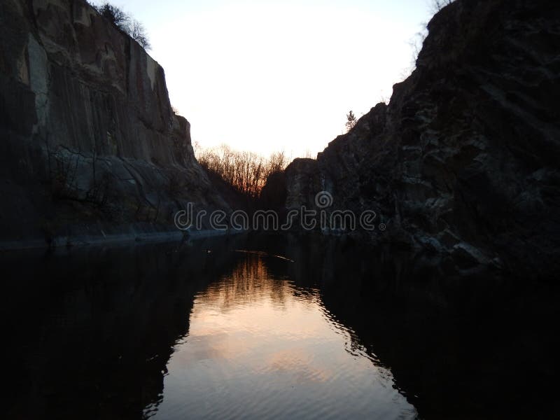 Beautiful Lake with Rocks at Sunset Stock Photo - Image of light ...