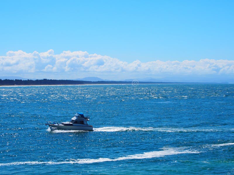 Beautiful Landscape of a Boat in the Blue Sea. Stock Photo - Image of ...