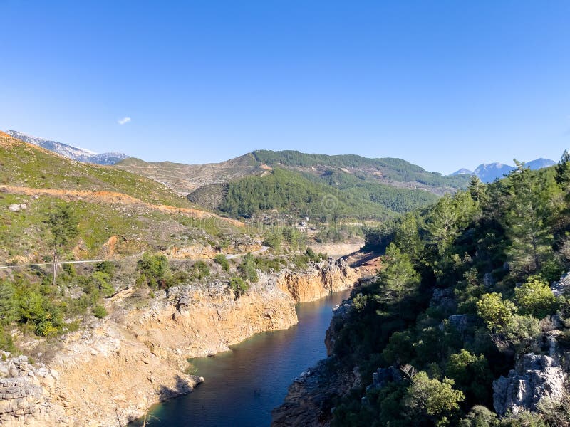 Beautiful Landscape Featuring a Rocky Canyon with a Deep Blue River Stock Photo - Image of ...