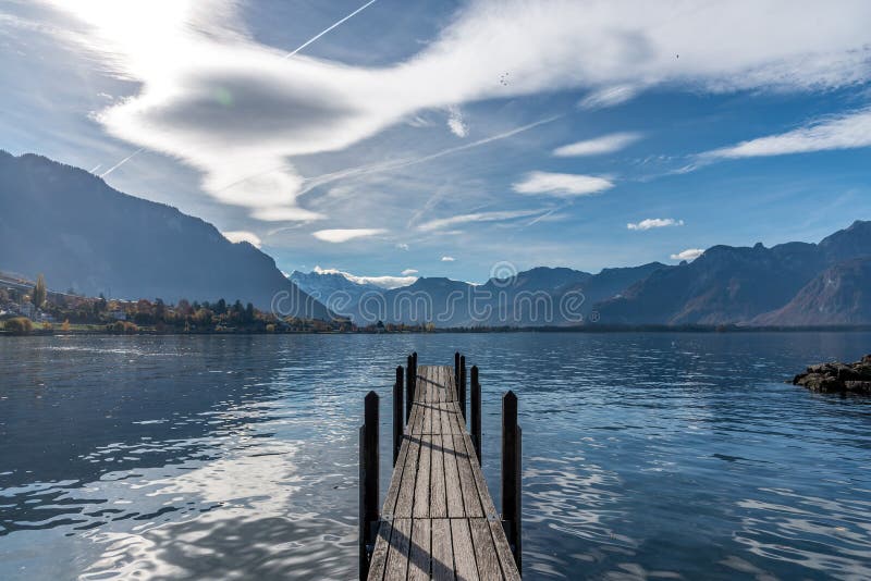 Beautiful Landscape with Mountains, Lake and Small Pier during Cloudy ...