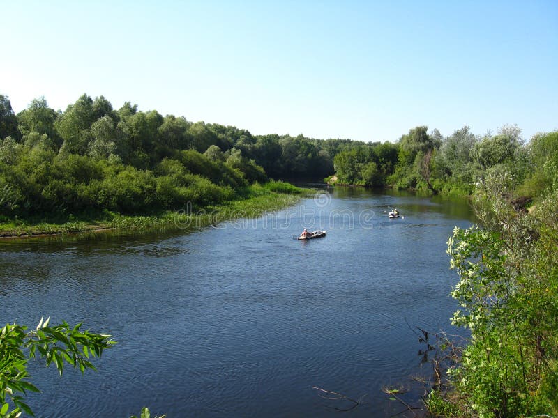 Beautiful Landscape with River and Canoe on it Stock Image - Image of ...