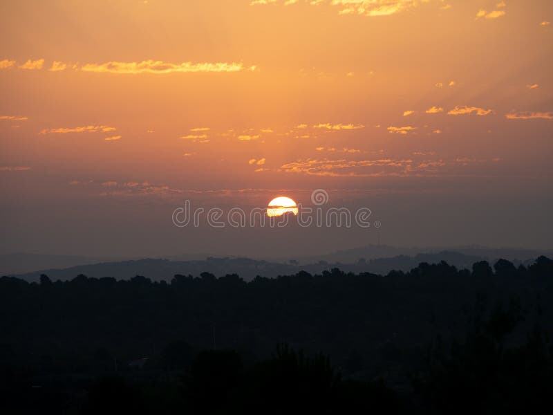 Beautiful Landscape Under an Evening Sky with the Glowing Sun Stock ...