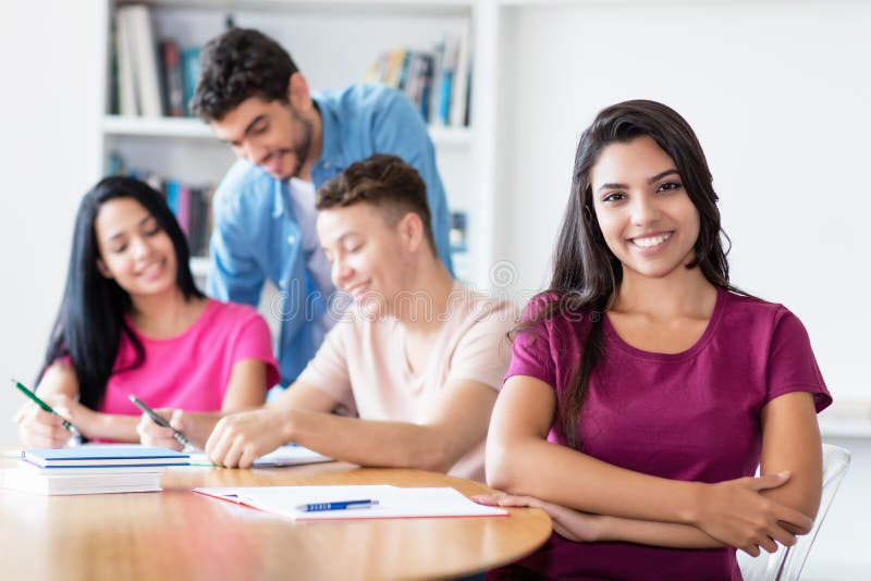 Beautiful Latin American Female Student Learning with Group of Students ...
