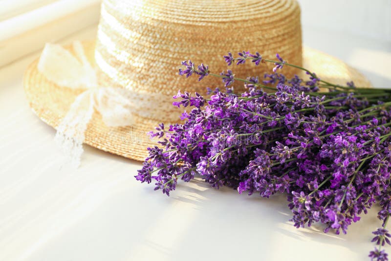 Beautiful Lavender Flowers and Straw Hat on Window Sill, Closeup Stock ...