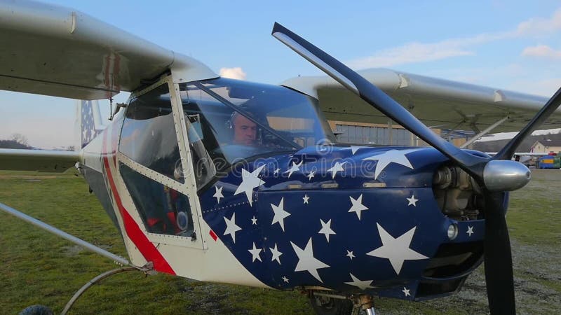 A Light Aircraft Gracefully Pulls an Airplane High Above a Clear Blue ...