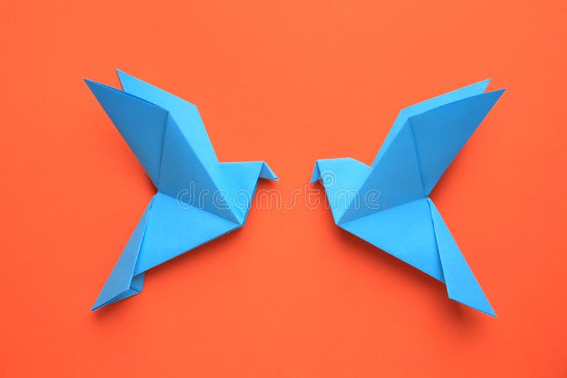 Beautiful Light Blue Origami Birds on Orange Background, Flat Lay Stock ...