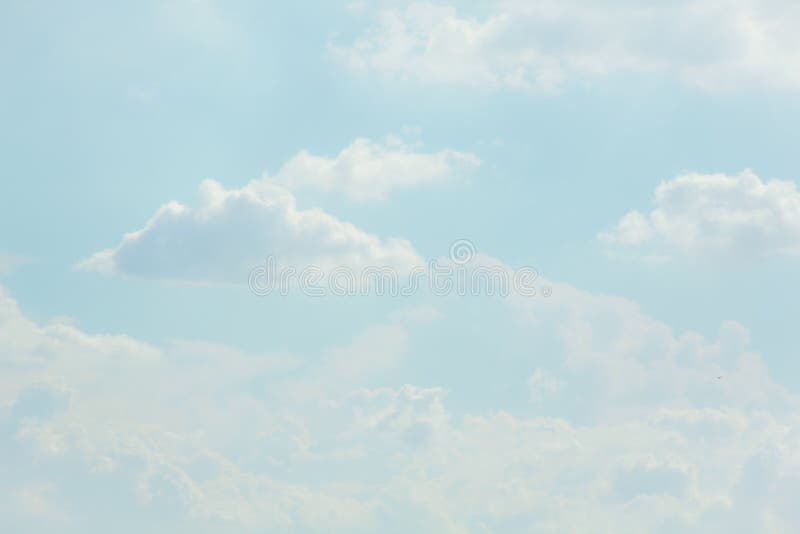 A Beautiful Light Blue Sky with White Feathery and Puffy Clouds. Stock ...