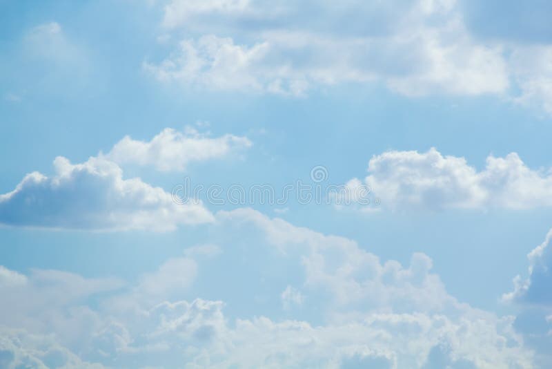 A Beautiful Light Blue Sky with White Feathery and Puffy Clouds. Stock ...