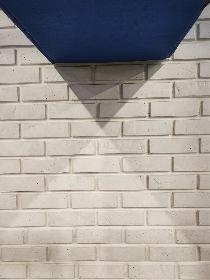 Beautiful Light and Shadow of a Triangle on Brick Wall Stock Photo ...
