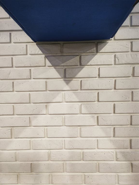 Beautiful Light and Shadow of a Triangle on Brick Wall Stock Photo ...