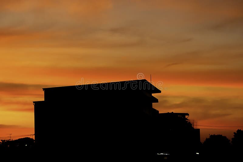 Beautiful Light of Sunset with Clouds in the Sky Reflection Behind the ...