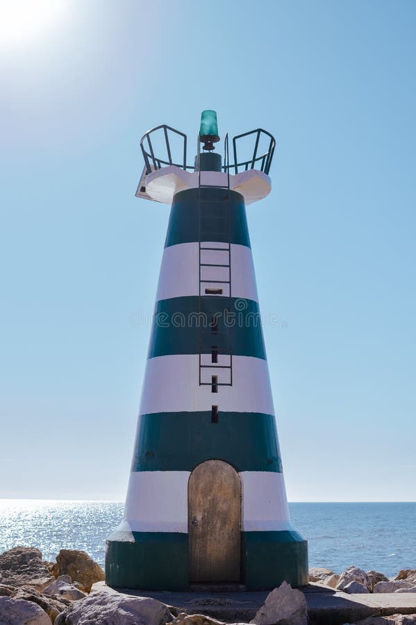 Beautiful Lighthouse with Calm Ocean Water Background. Sunny Day ...