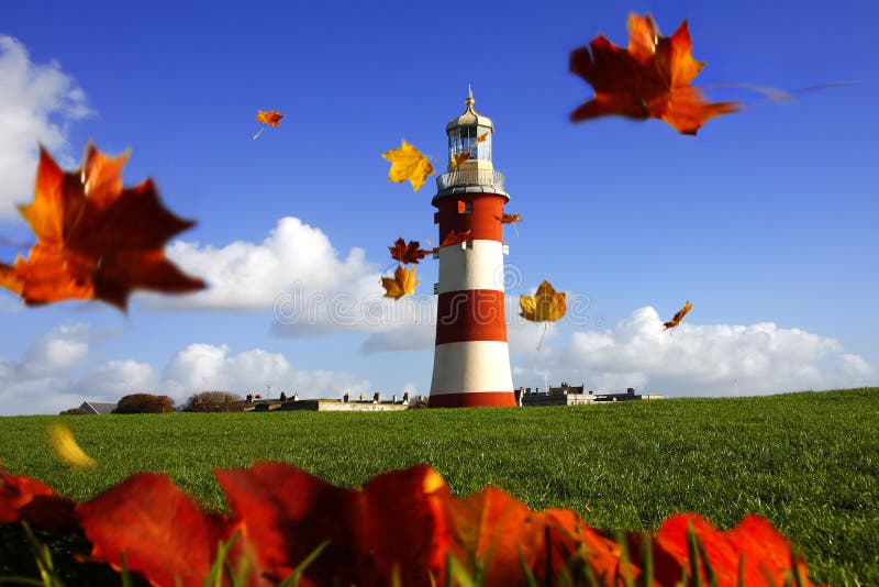 Beautiful Lighthouse With Flying Autumn Leaves Stock Photo - Image: 7673872