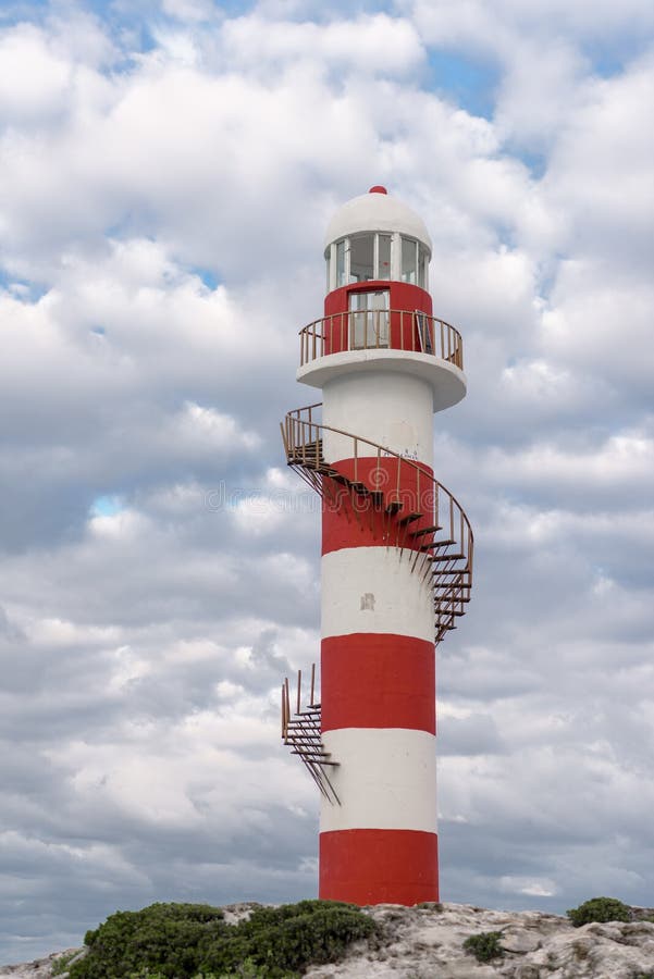 Beautiful Lighthouse On The Shore Of The Rocks Overlooking The Sky ...
