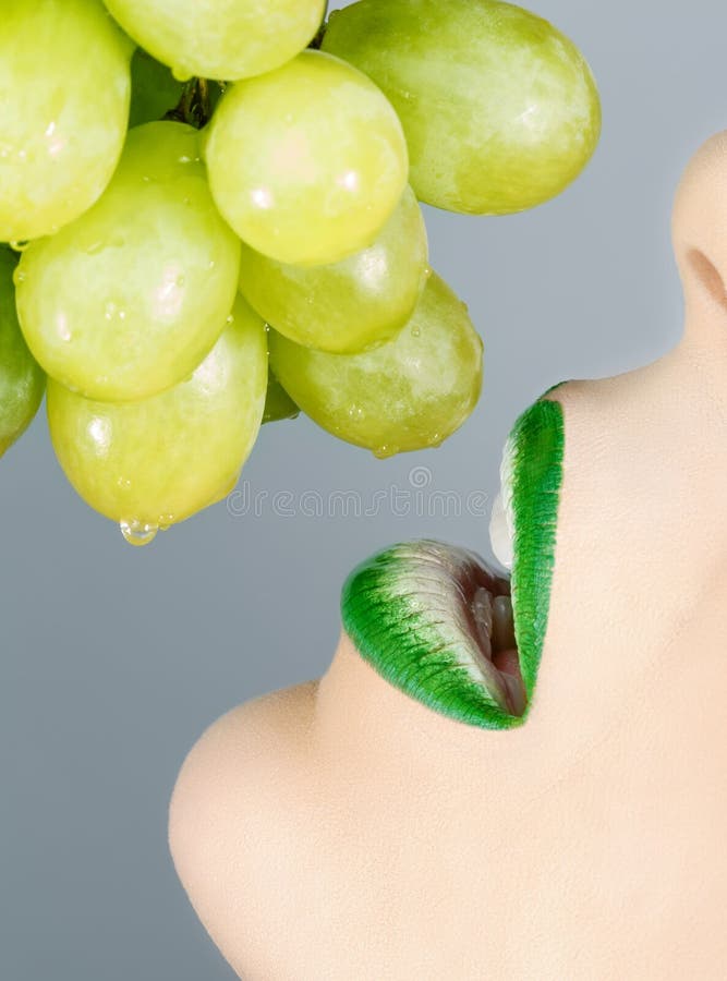 Beautiful lips and grapes stock photo. Image of gloss - 29319784