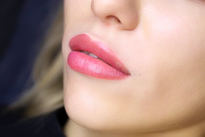 The Beautiful Lips of a Young Model with a Lip Tattoo Stock Image ...