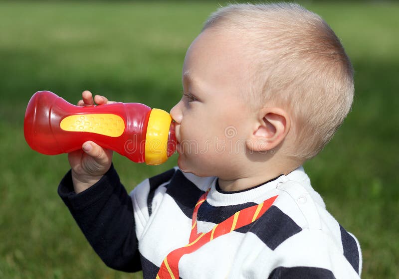 Beautiful Little Boy Drinking Stock Image - Image of face, little: 21698967