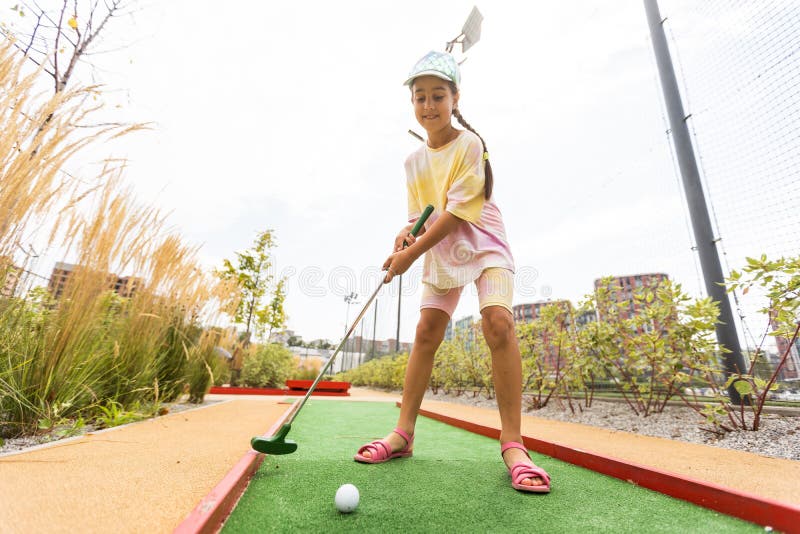Beautiful Little Girl Playing Mini Golf Stock Image - Image of cheerful ...