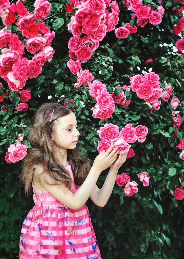 Beautiful Little Girl with Roses Outdoors. Stock Image - Image of cute ...