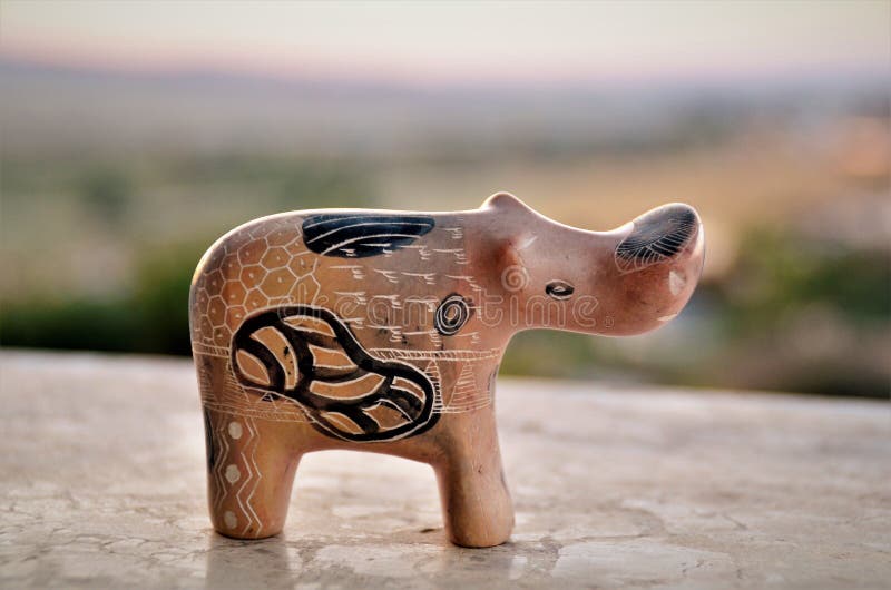 A Beautiful Little Pink Decorative Stone Hippo on the Balcony Stock ...