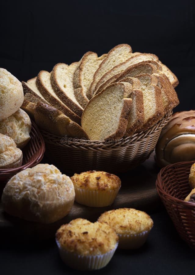 Beautiful Loaves and Pastries in Low Light on Black Background Stock ...