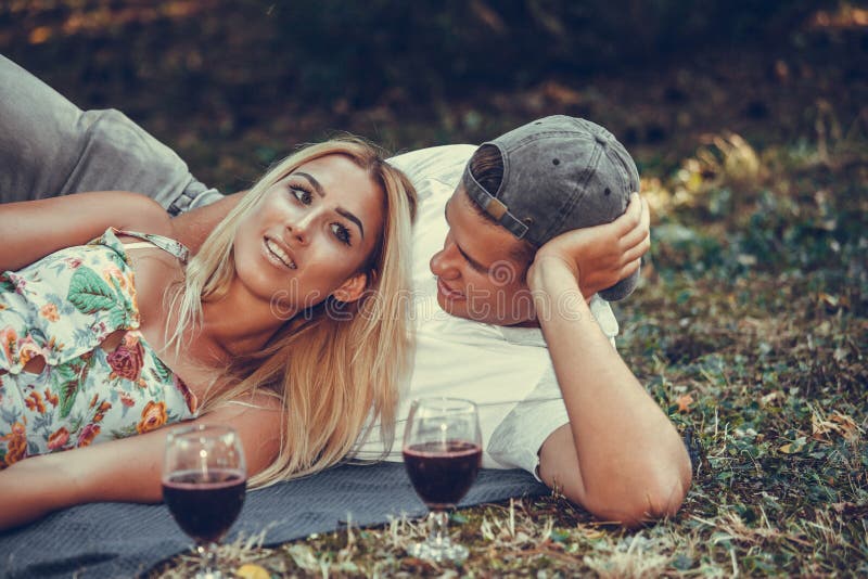 Beautiful Loving Couple is Talking and Hugging while Resting on the ...