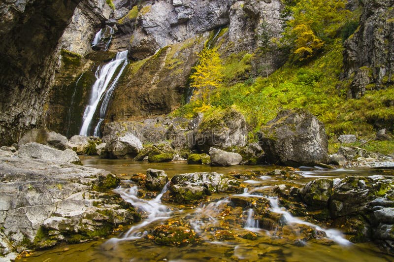 Beautiful Low Angle Shot of a Waterfall in the Middle of the Forest ...