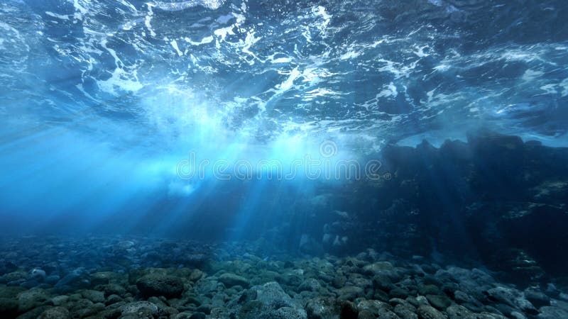 Underwater Rays of Light Breaking through the Waves Stock Image - Image ...