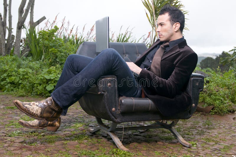 Beautiful Man with Laptop Sitting in an Armchair Stock Image - Image of ...