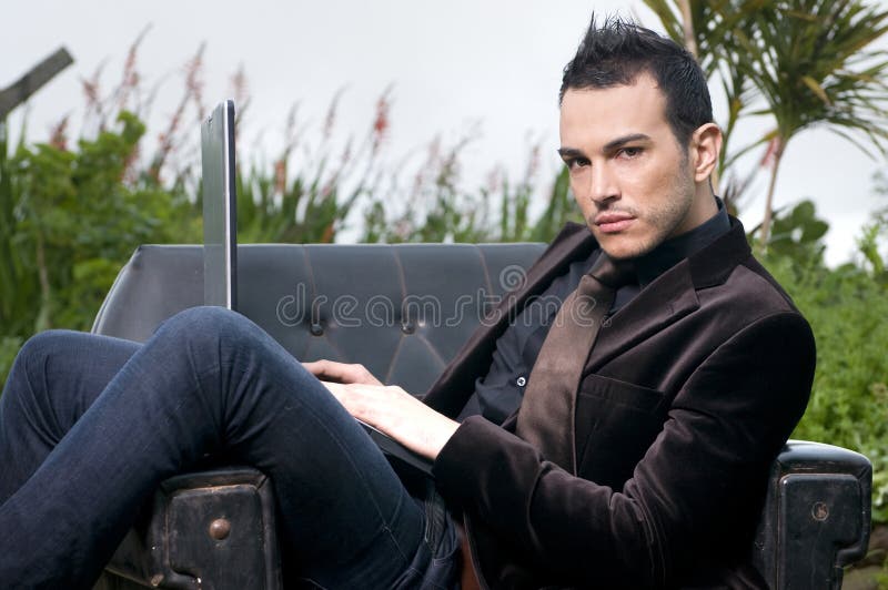 Beautiful Man with Laptop Sitting in an Armchair Stock Photo - Image of ...