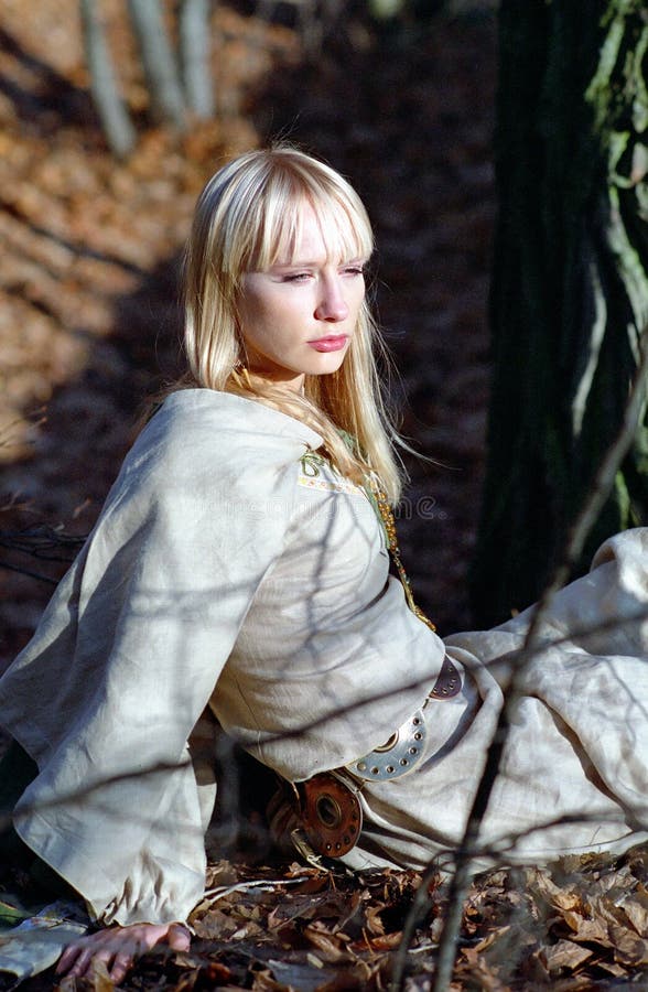 Beautiful Medieval Woman Sitting in Forest Stock Photo - Image of ...
