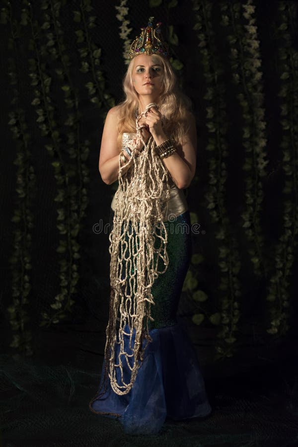 The Beautiful Mermaid Hit the Net Underwater Stock Photo - Image of ...