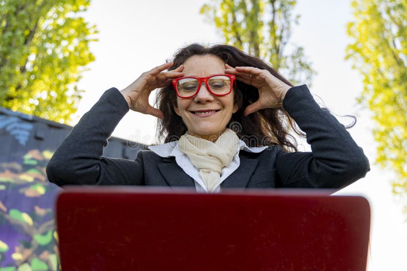 Beautiful Middle-aged Female Manager Smiling with Hands on Head ...