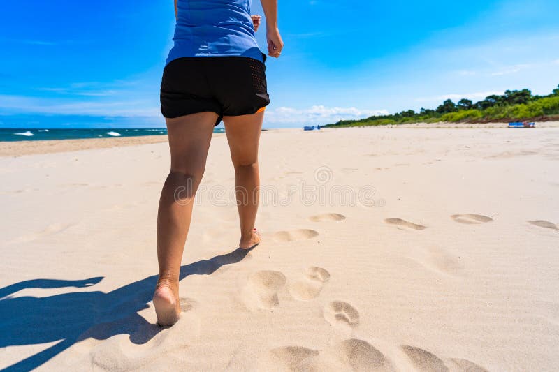 Beautiful Middle Aged Woman Training Running on Sandy Beach in ...