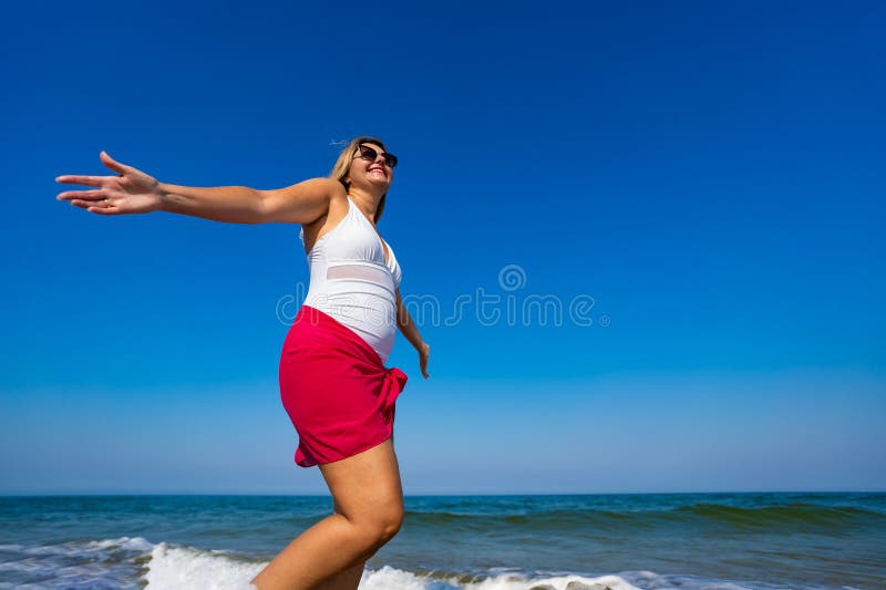 Beautiful Middle-aged Woman Walking on Sandy Beach in Summertime ...