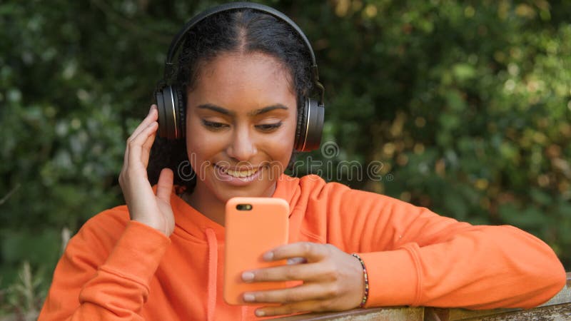 African American Girl Teenager Young Woman Listening To Music On Her
