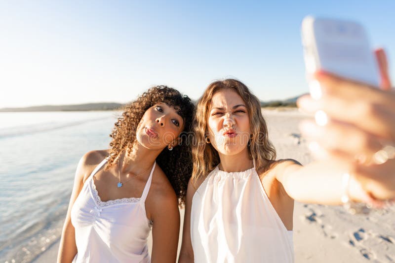 Beautiful Mixed Race Female Love Couple Making Faces Doing Self